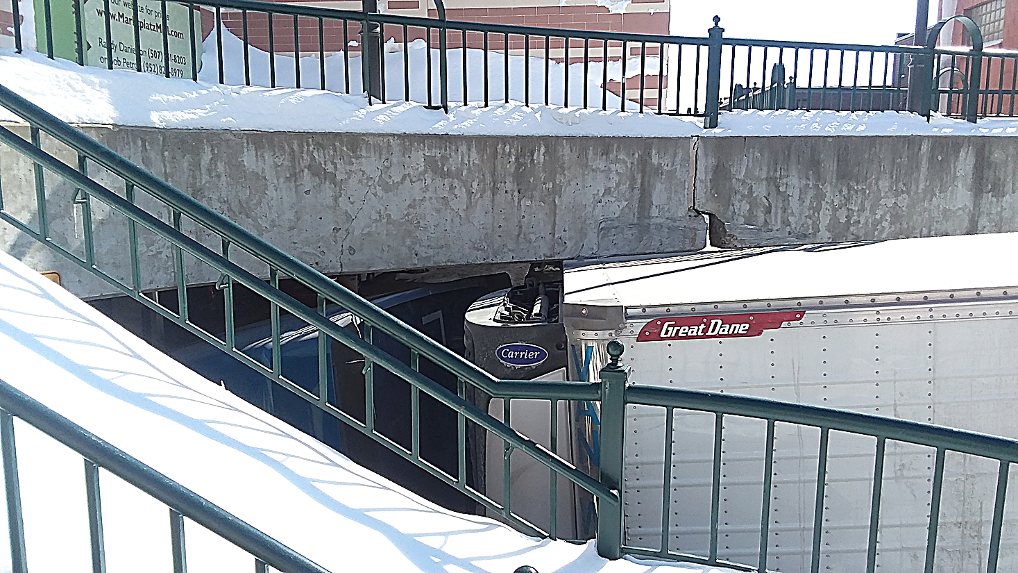 Stuck: Semi strikes bridge under mall | News, Sports, Jobs - The Journal